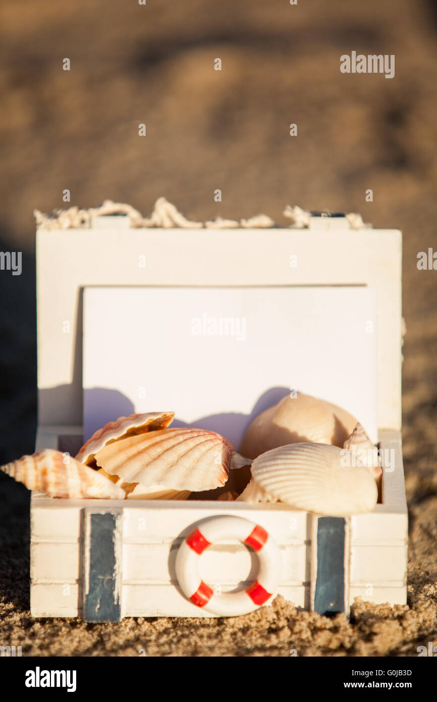 sailing boat and seashell in sand decoration closeup Stock Photo - Alamy