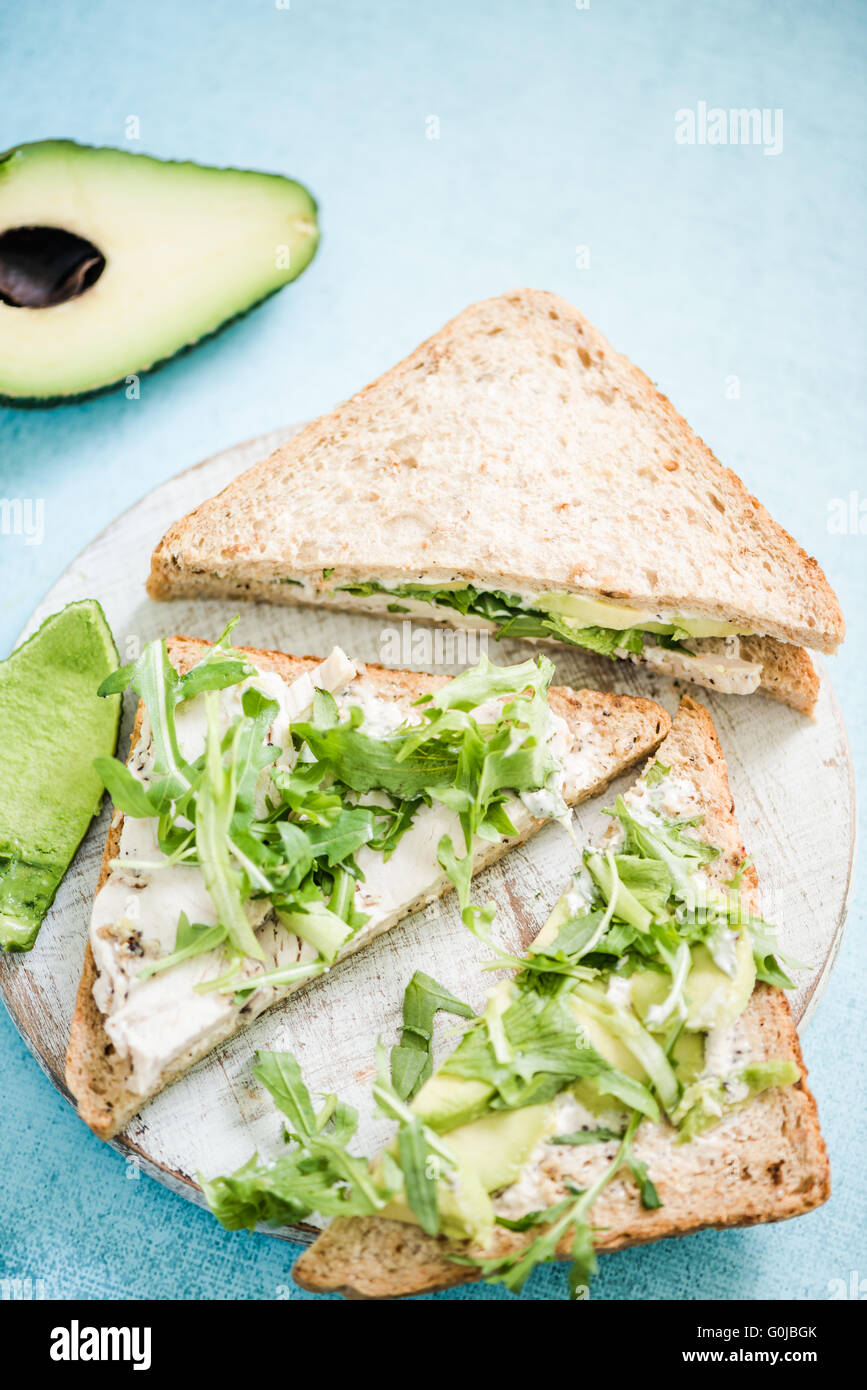 Chicken and avocado wholegrain bread sandwich triangles Stock Photo - Alamy