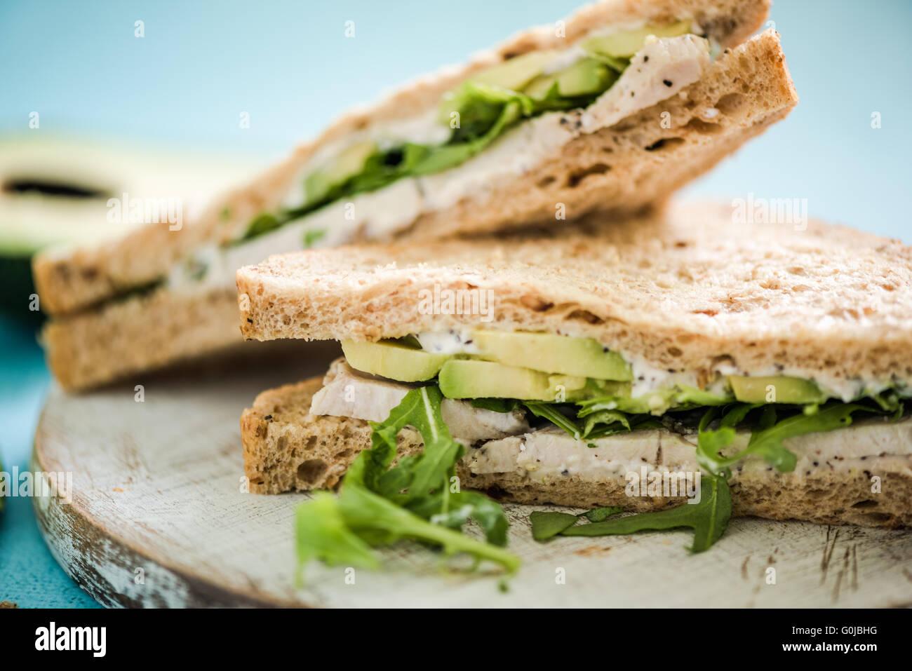 Chicken and avocado wholegrain bread sandwich triangles Stock Photo - Alamy