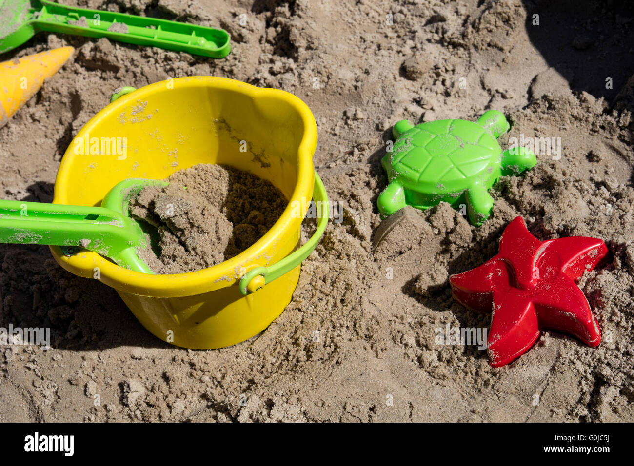 Plastic colored toys in the sand hi-res stock photography and images ...