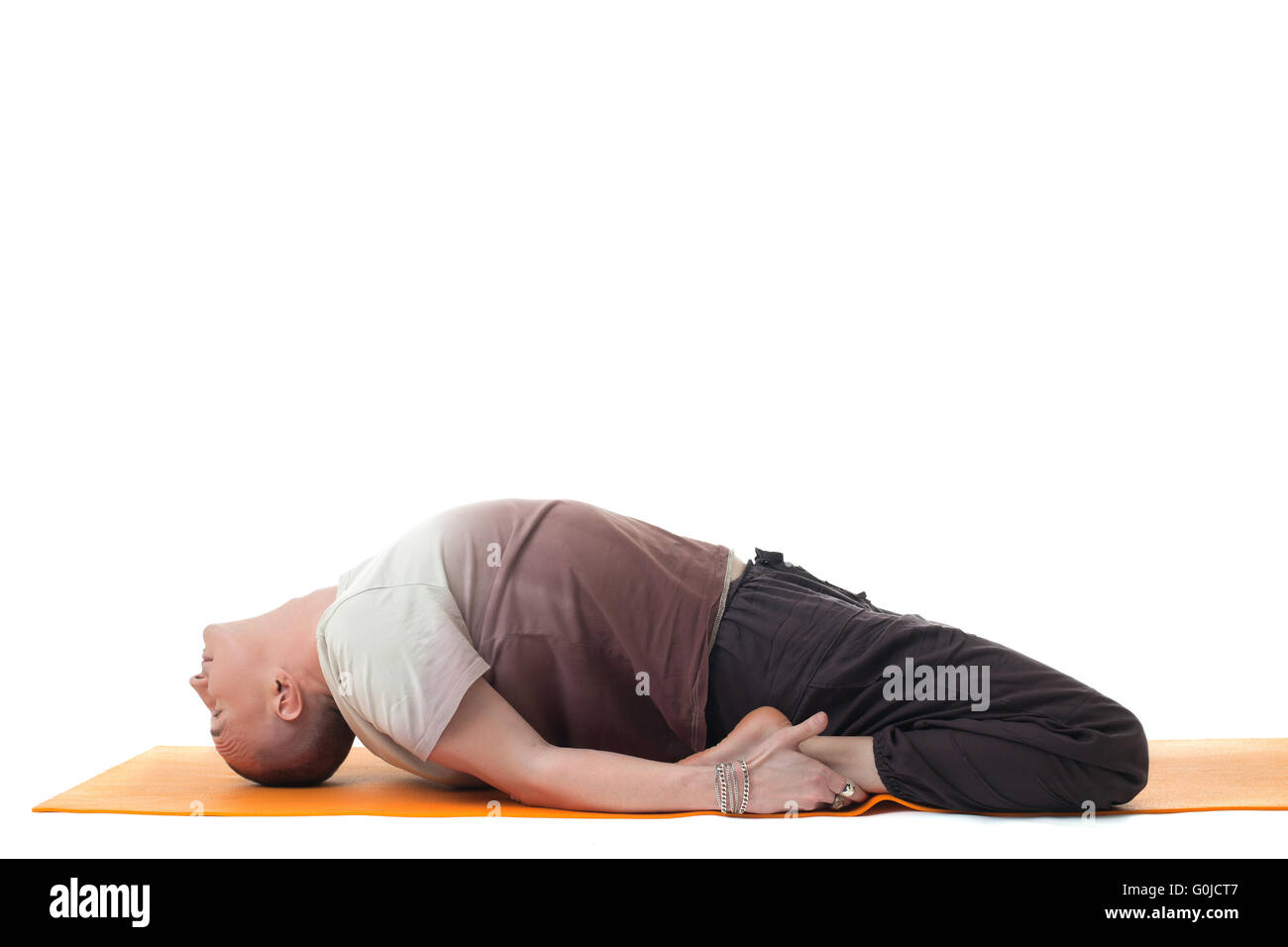 Image of flexible man lying in relaxed position Stock Photo - Alamy