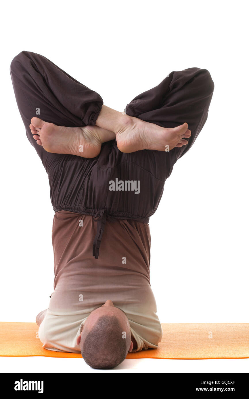 Image of flexible yogi posing in difficult pose Stock Photo - Alamy