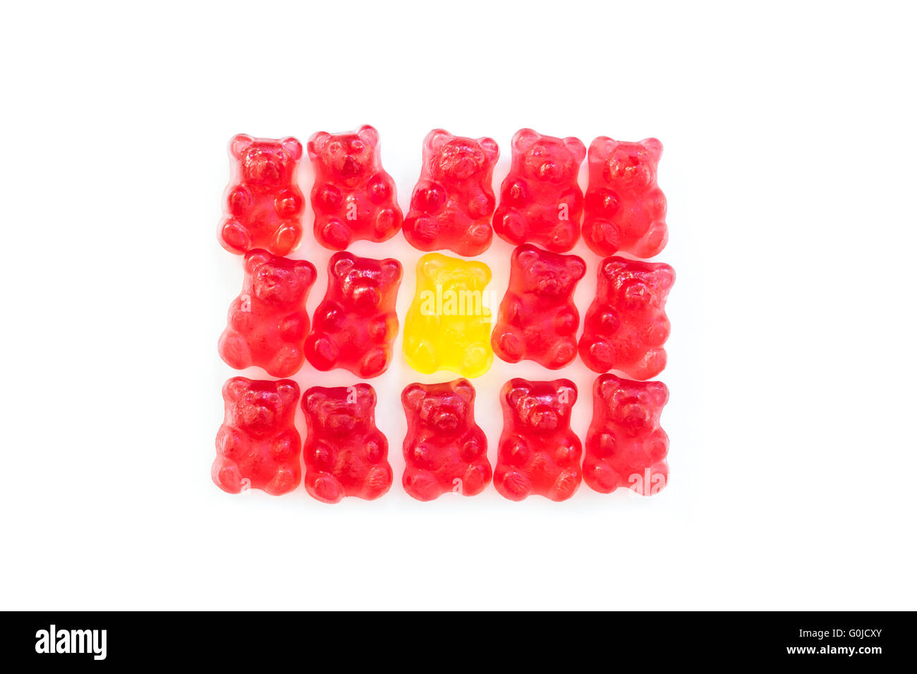 Detail of group of red gummy bears and one in yellow with isolated ...