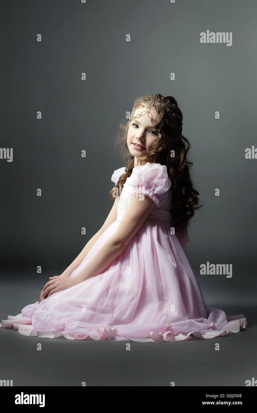 Beautiful girl in smart dress smiling at camera Stock Photo - Alamy