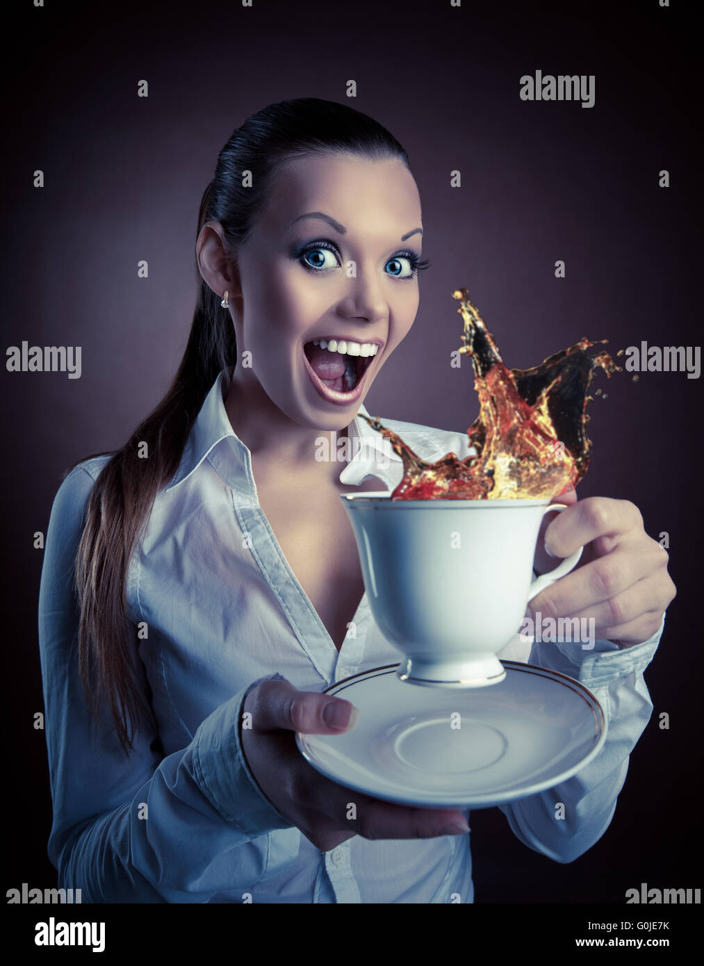 funny Woman with cup and splash of tea smile Stock Photo - Alamy
