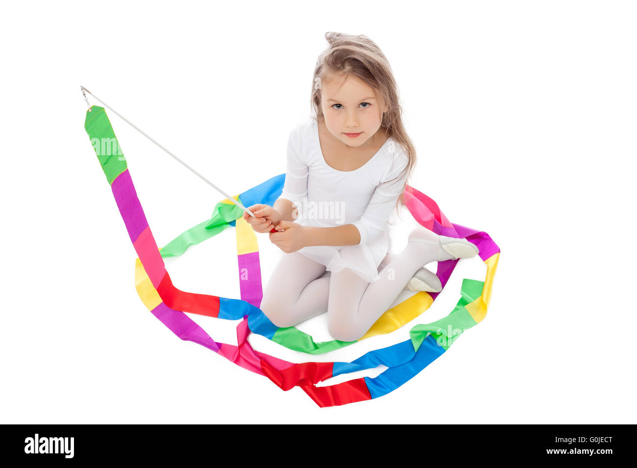Adorable little girl posing with colorful ribbon Stock Photo - Alamy