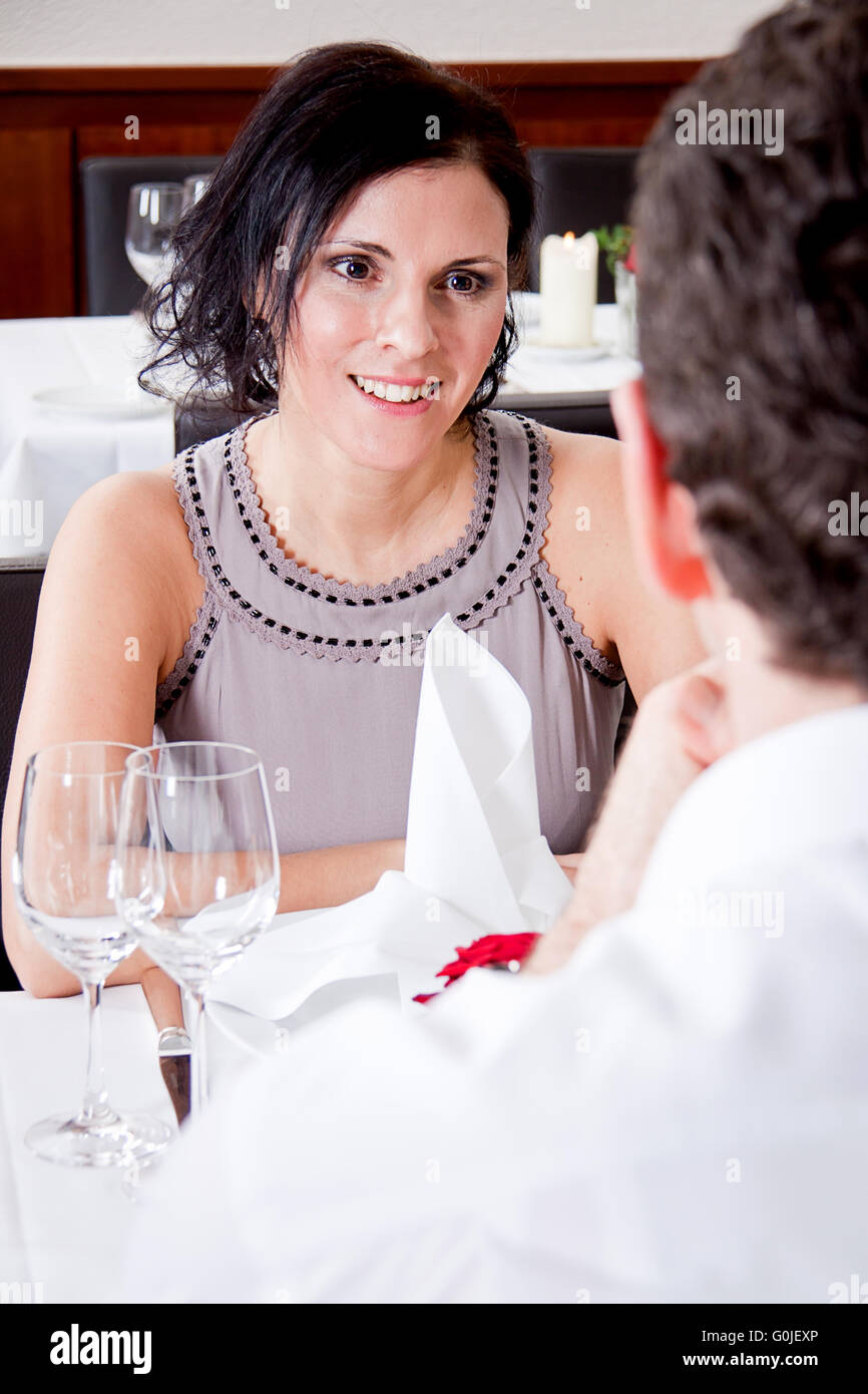 happy smiling couple in restaurant celebrate Stock Photo - Alamy