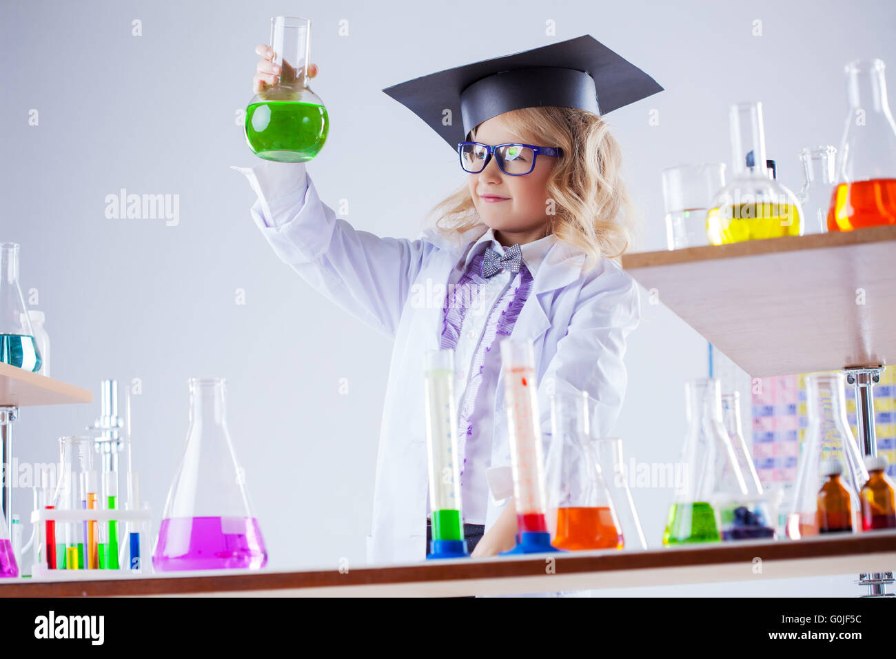 Young chemist posing with variety of reagents Stock Photo - Alamy