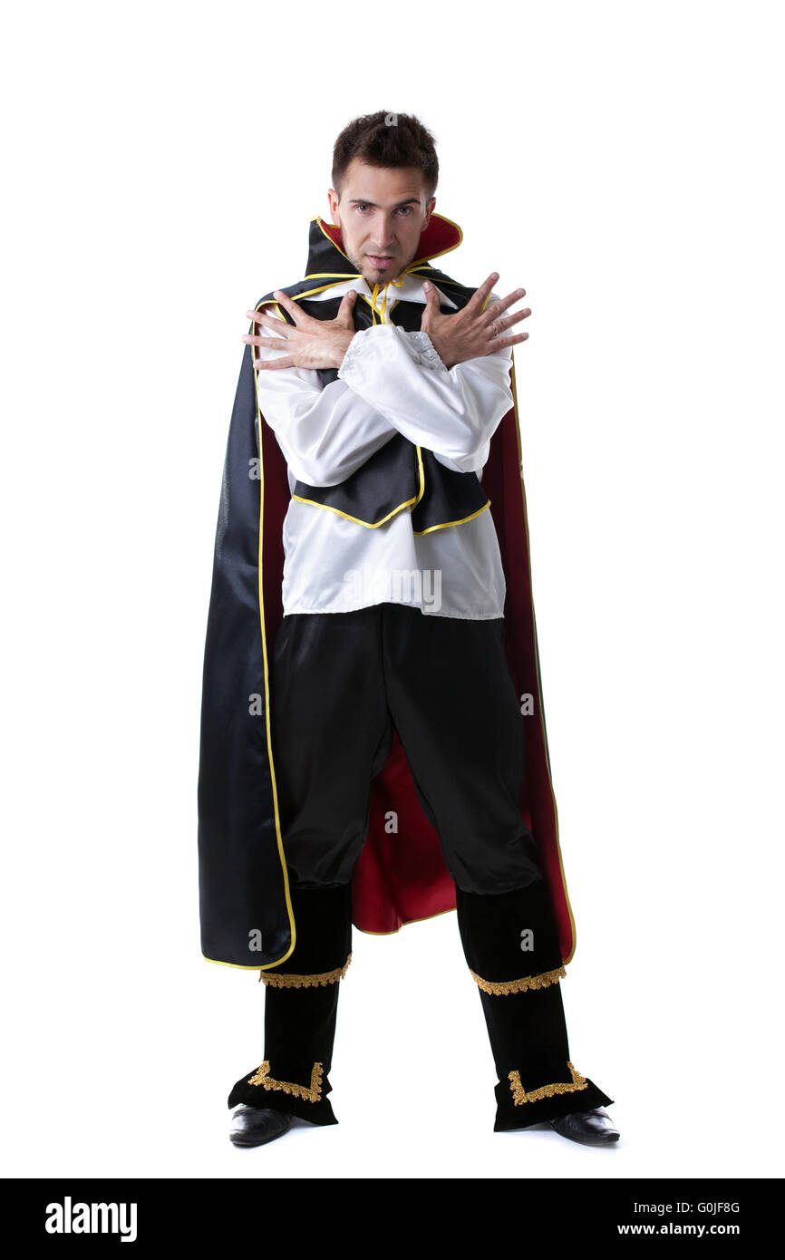 Pretentious man posing in costume of illusionist Stock Photo - Alamy