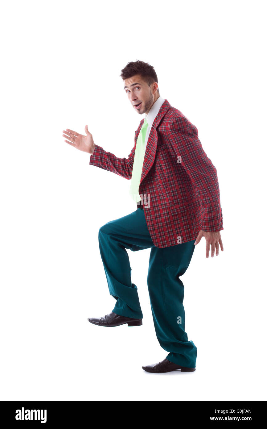 Studio shot of merry man posing in large suit Stock Photo - Alamy