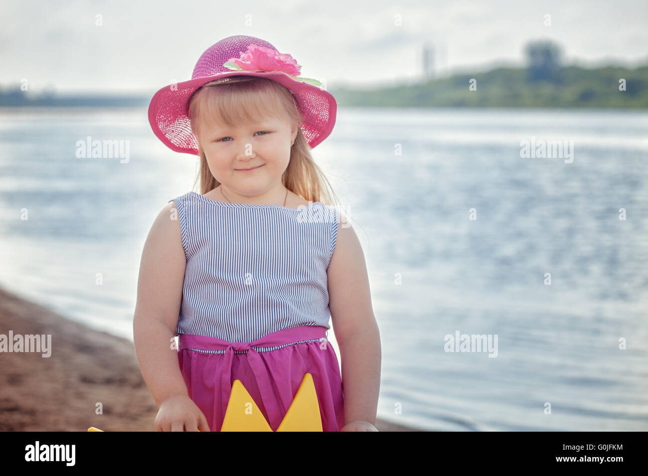 Image of little fair-haired girl posing at camera Stock Photo - Alamy