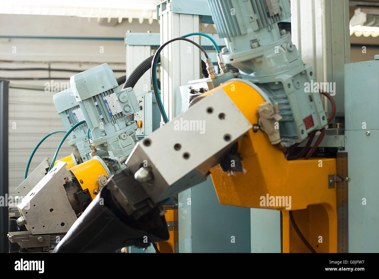 Modern factory equipment for production of boots Stock Photo - Alamy