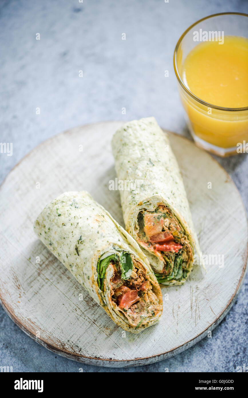 serving healthy breakfast, wrap and orange juice Stock Photo - Alamy