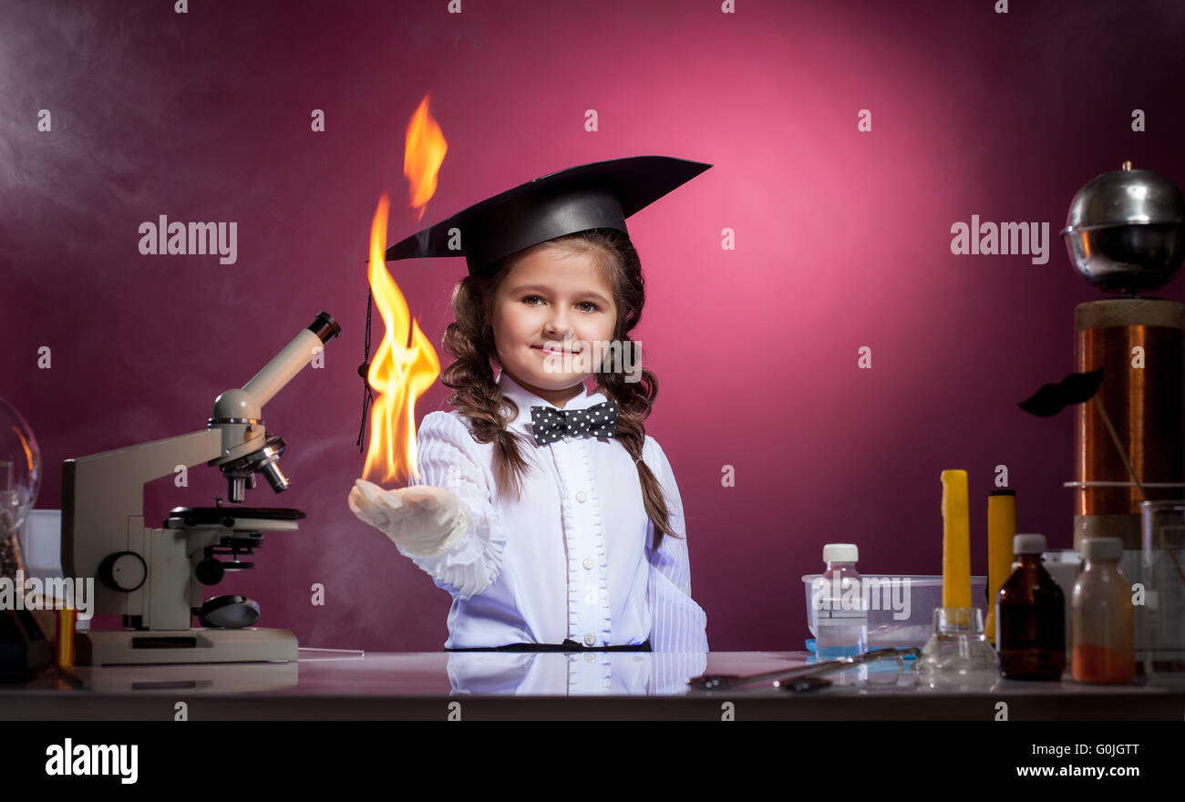 Cute girl conducts physical experience in lab Stock Photo - Alamy