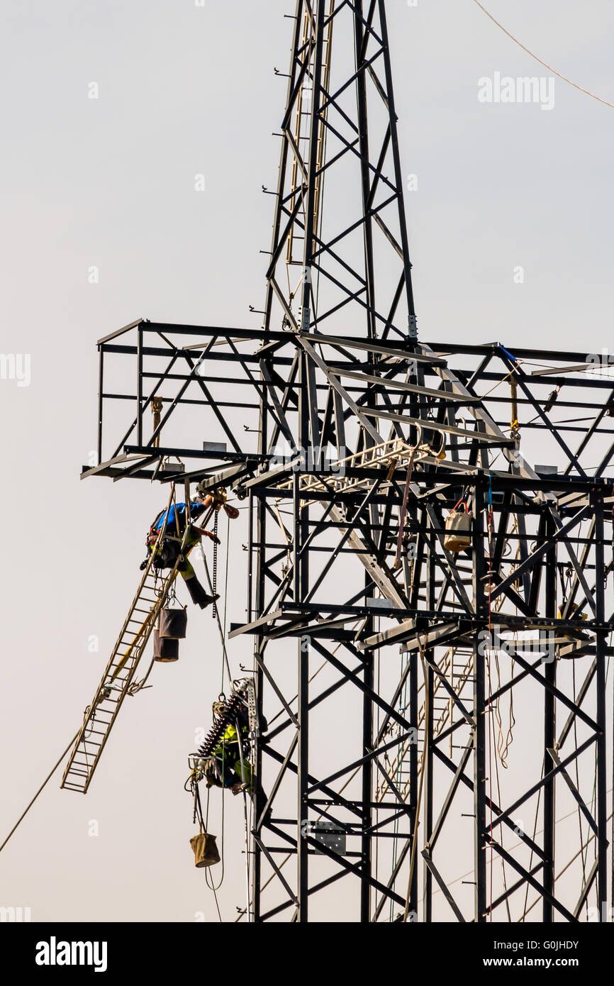working on a power poles Stock Photo - Alamy