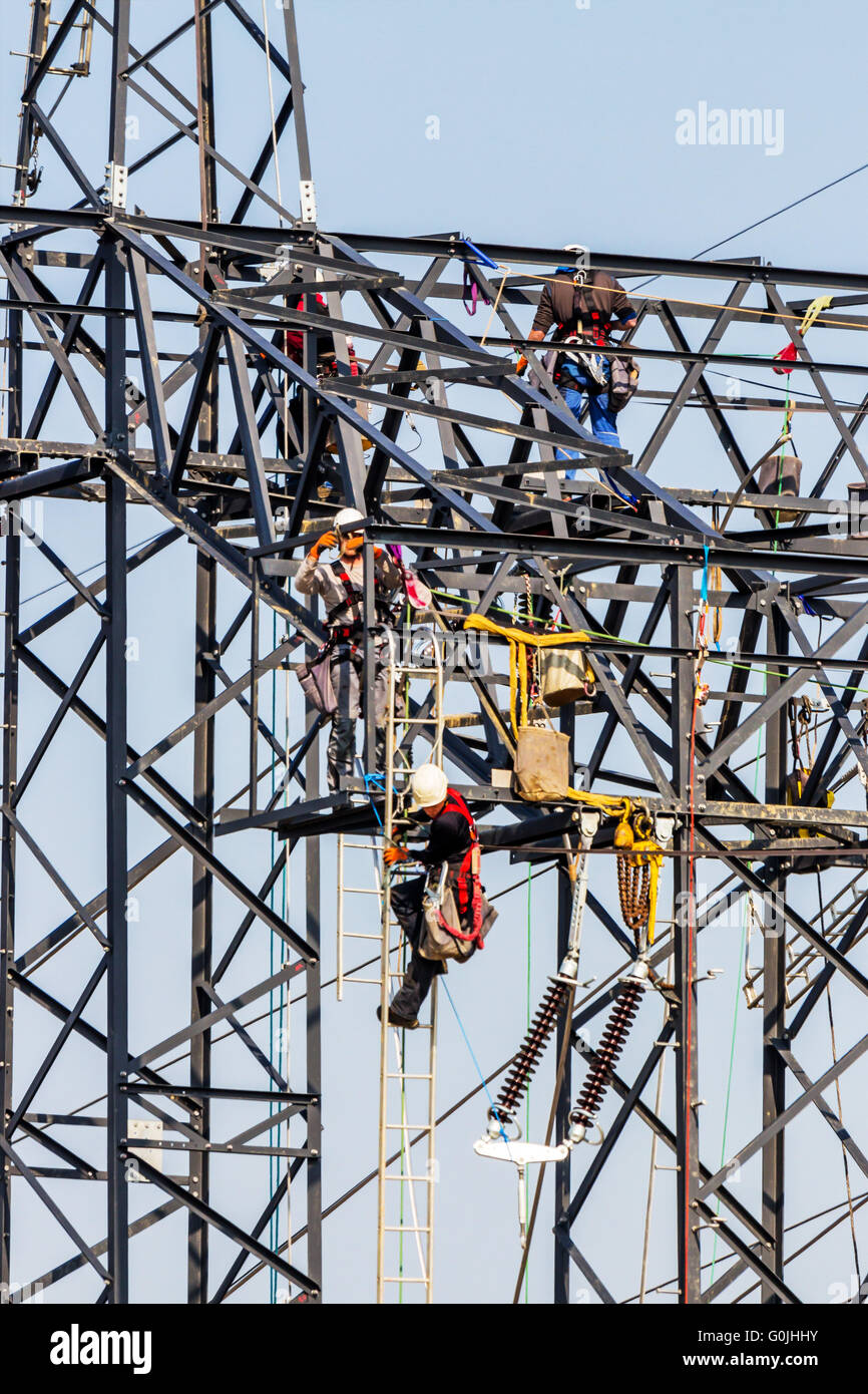 working on a power poles Stock Photo - Alamy