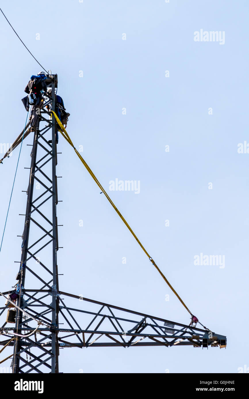 working on a power poles Stock Photo - Alamy