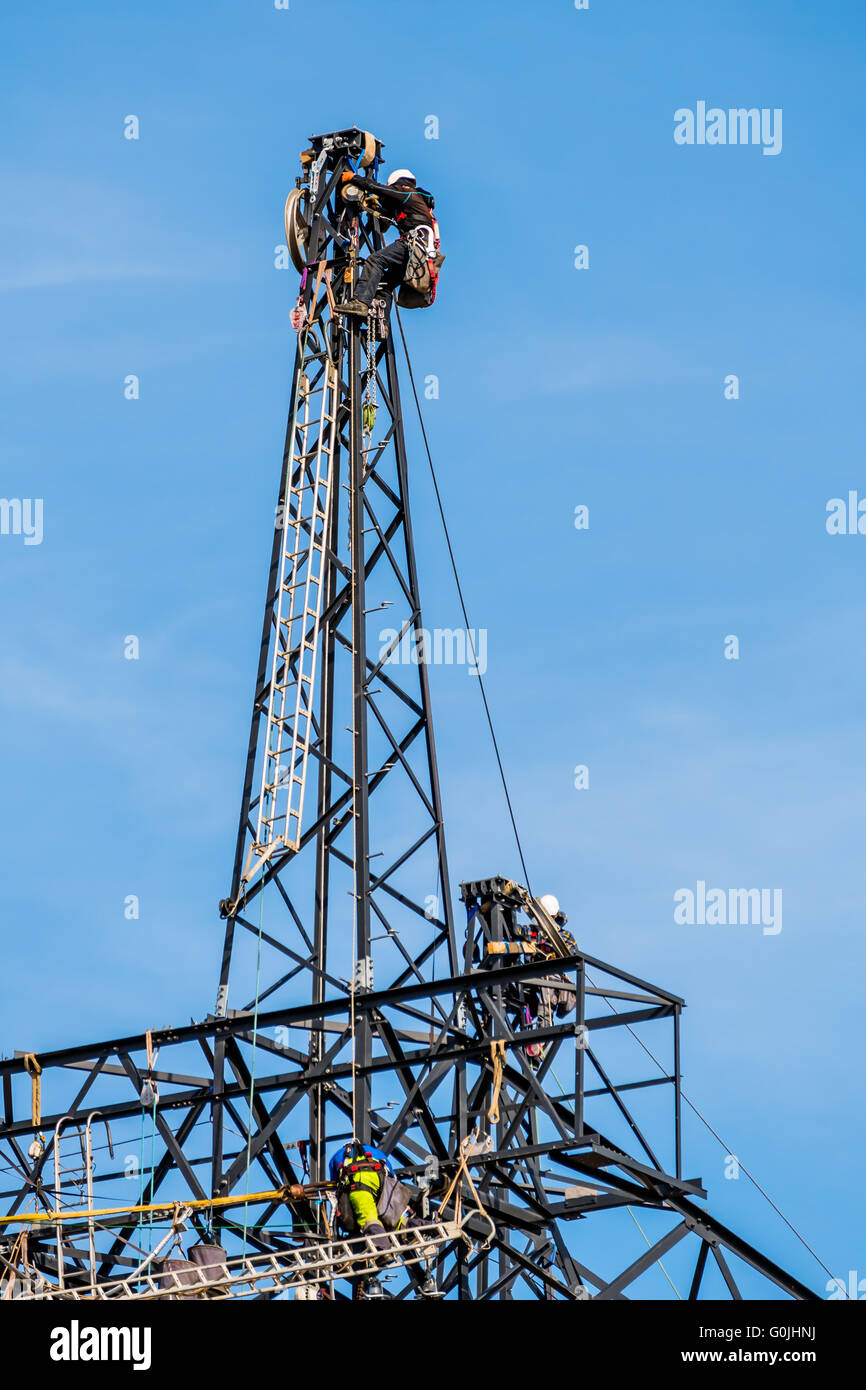 working on a power poles Stock Photo - Alamy