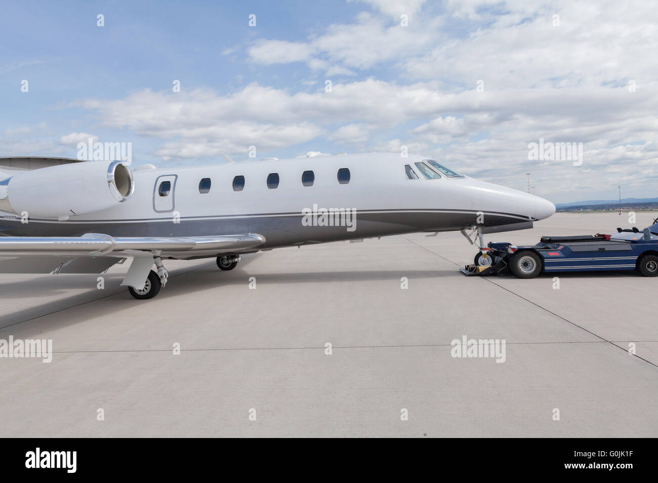 Aircraft learjet Plane in front of the Airport with cloudy sky Stock ...