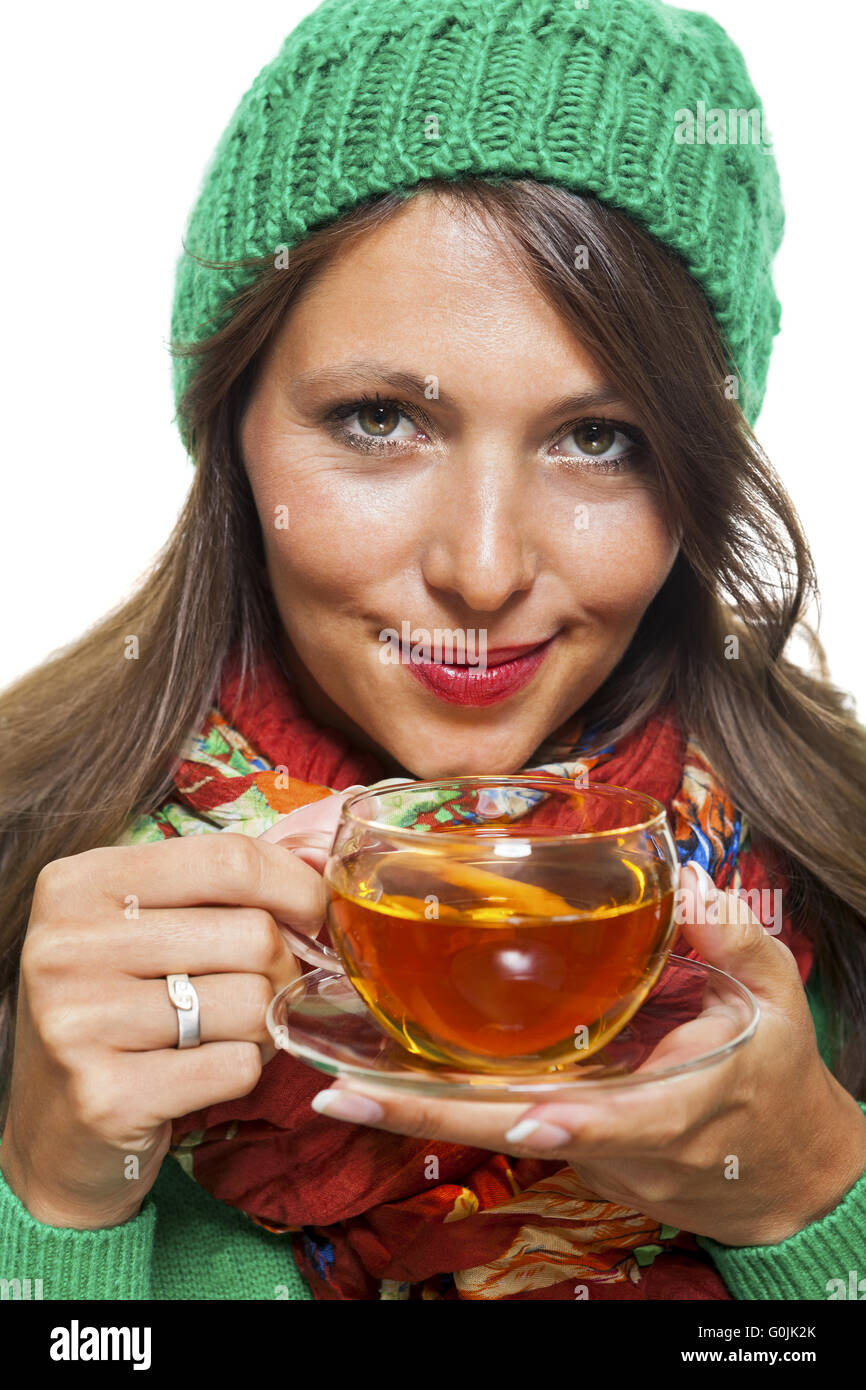 Attractive woman warming up with a cup of hot tea Stock Photo - Alamy