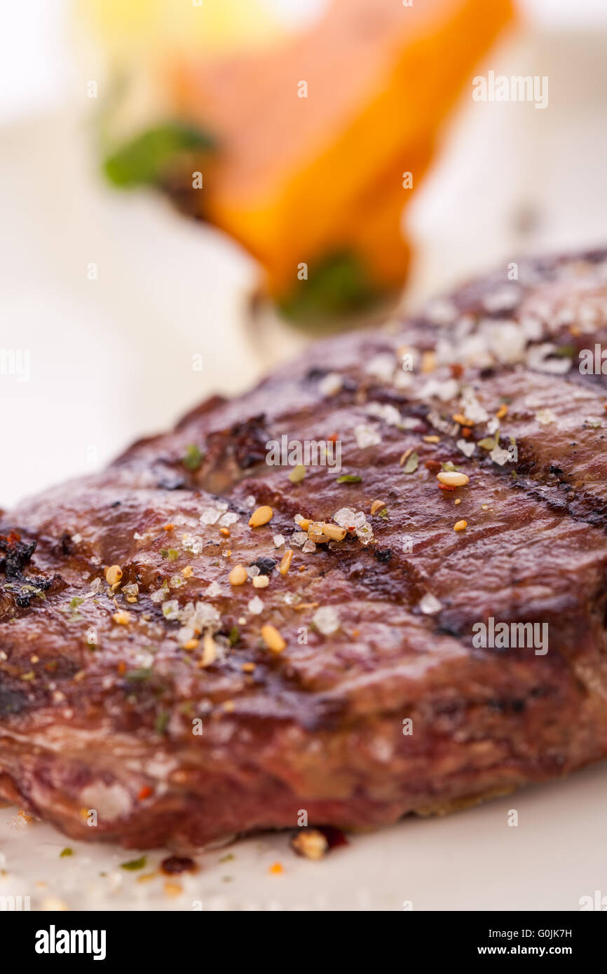 Grilled beef steak with seasoning Stock Photo - Alamy