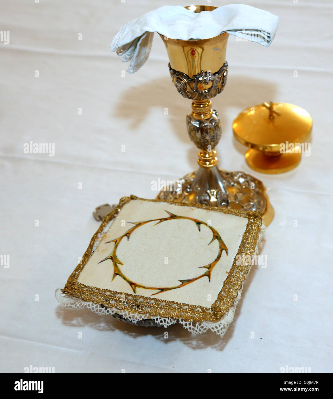Golden Chalice with wine in the altar of a Christian Church during Holy ...