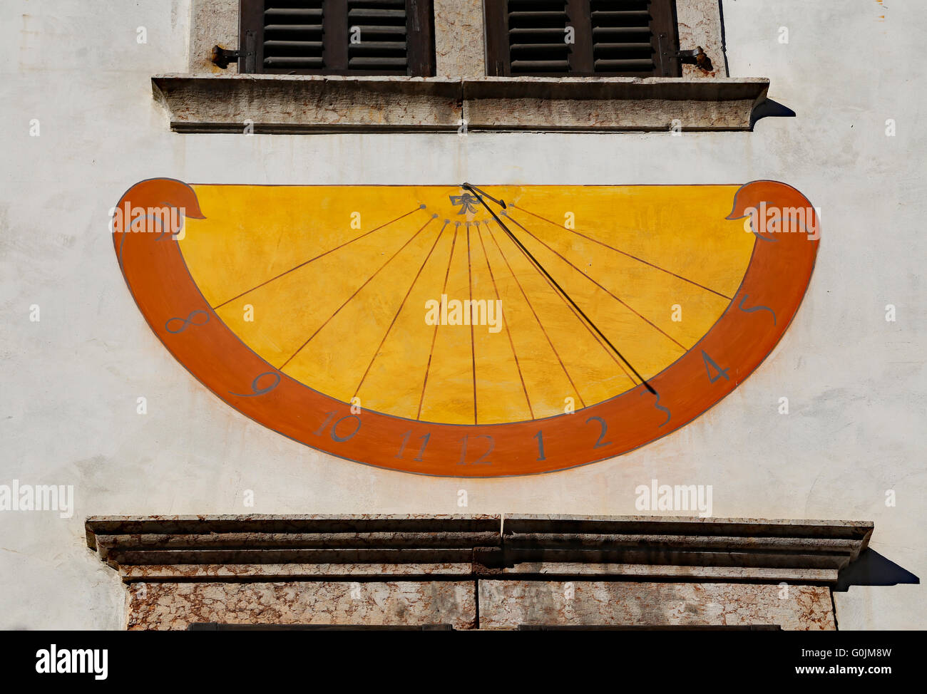 Sundial with numerals marking the hours with the shadow of the Gnomon ...