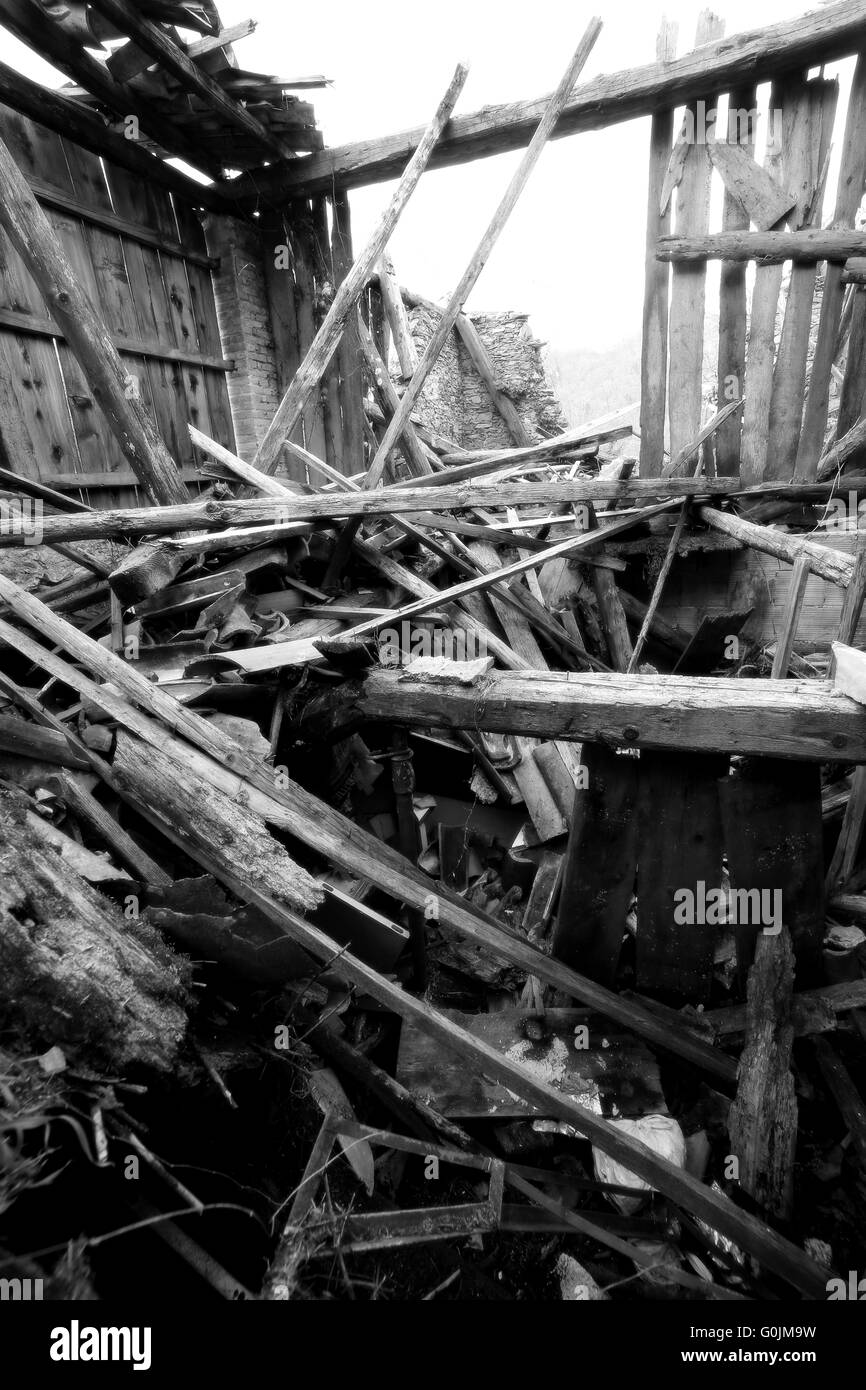 wooden planks and rubble and the ruins of the house completely ...