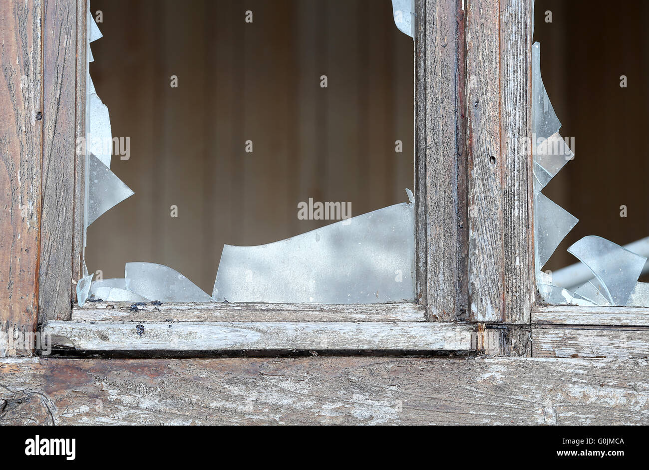 fragments of broken glass of a window in an abandoned house Stock Photo ...