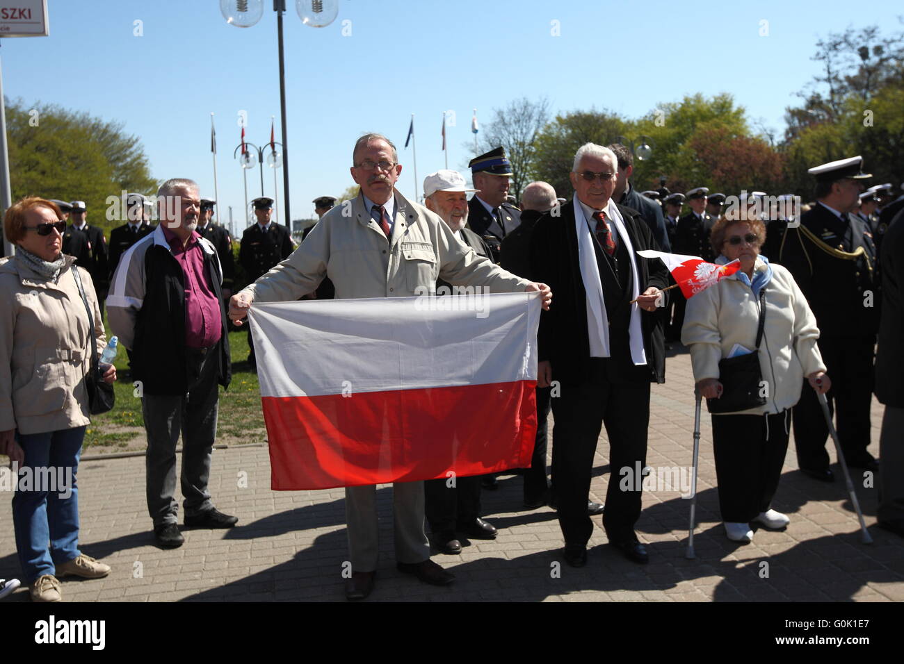 Gdynia, Poland 2nd, May 2016 Man holding Polish national flag is seen ...