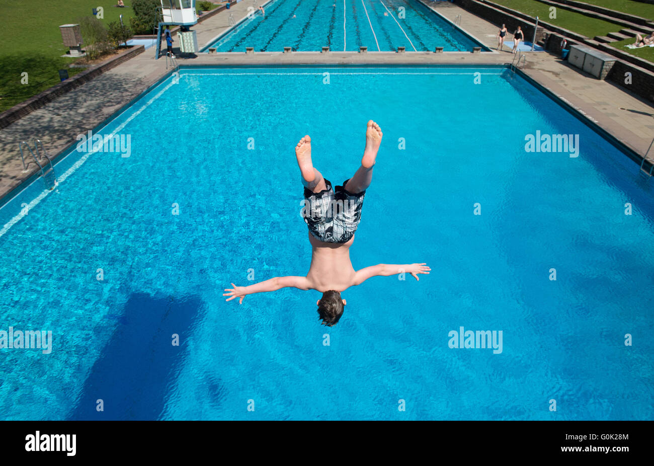 Leopold (10) jumping of a diving platform at Kaifu swimming pool in ...