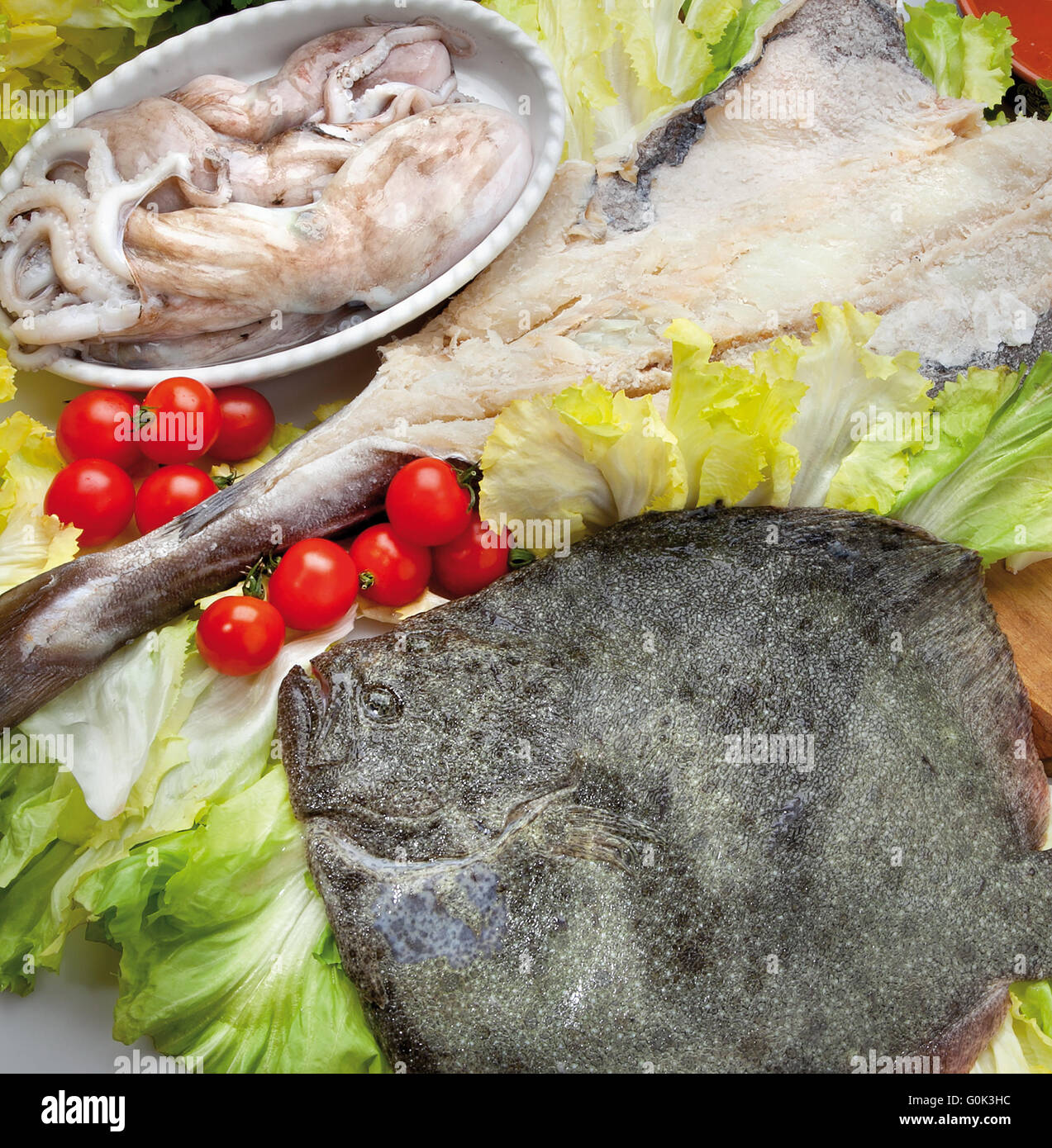 stockfish fish composition, squid, clams with salad and tomatoes Stock ...