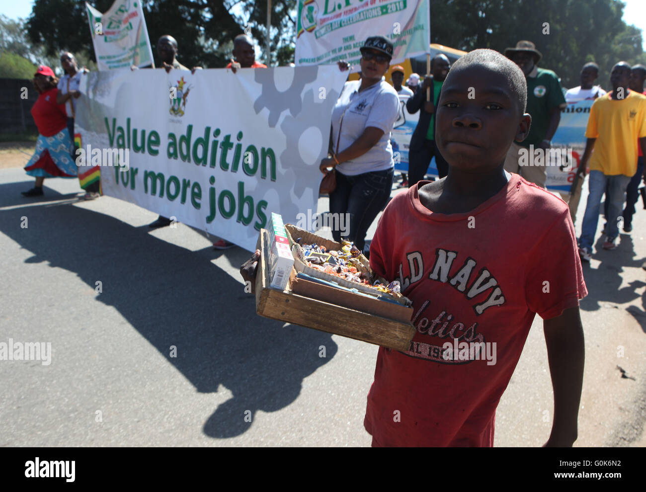 Harare, Zimbabwe. 2nd May, 2016. A boy carrying candies and cigarettes ...