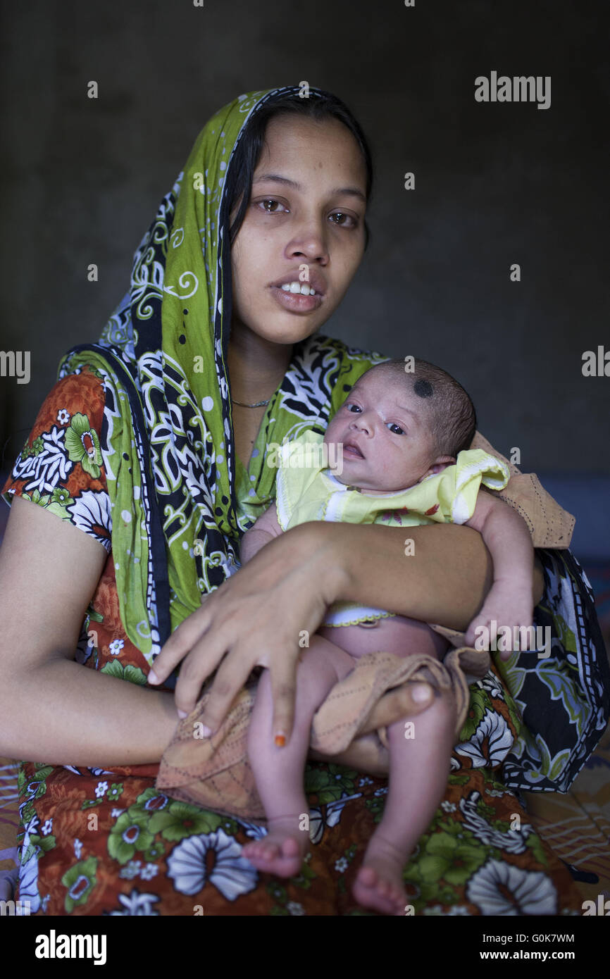 Savar, Dhaka, Bangladesh. 14th Nov, 2013. NAZMA AKHTER (21) with her ...