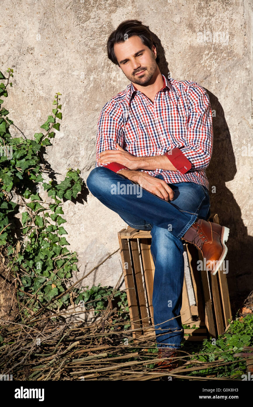 Male model sitting legs crossed hi-res stock photography and images - Alamy