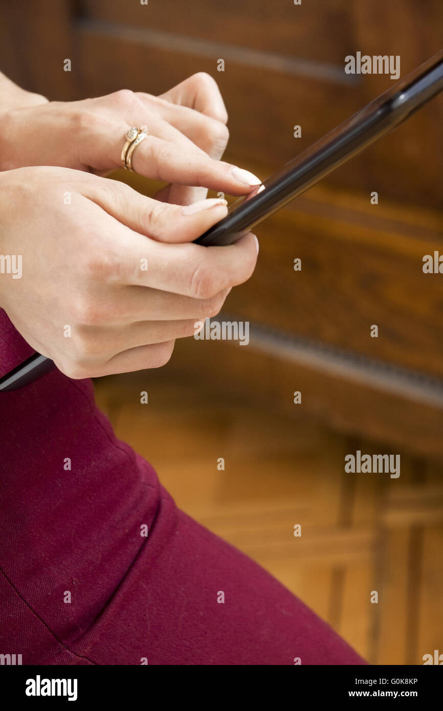 Standing Young Office Woman Writing on a Desk Stock Photo - Alamy