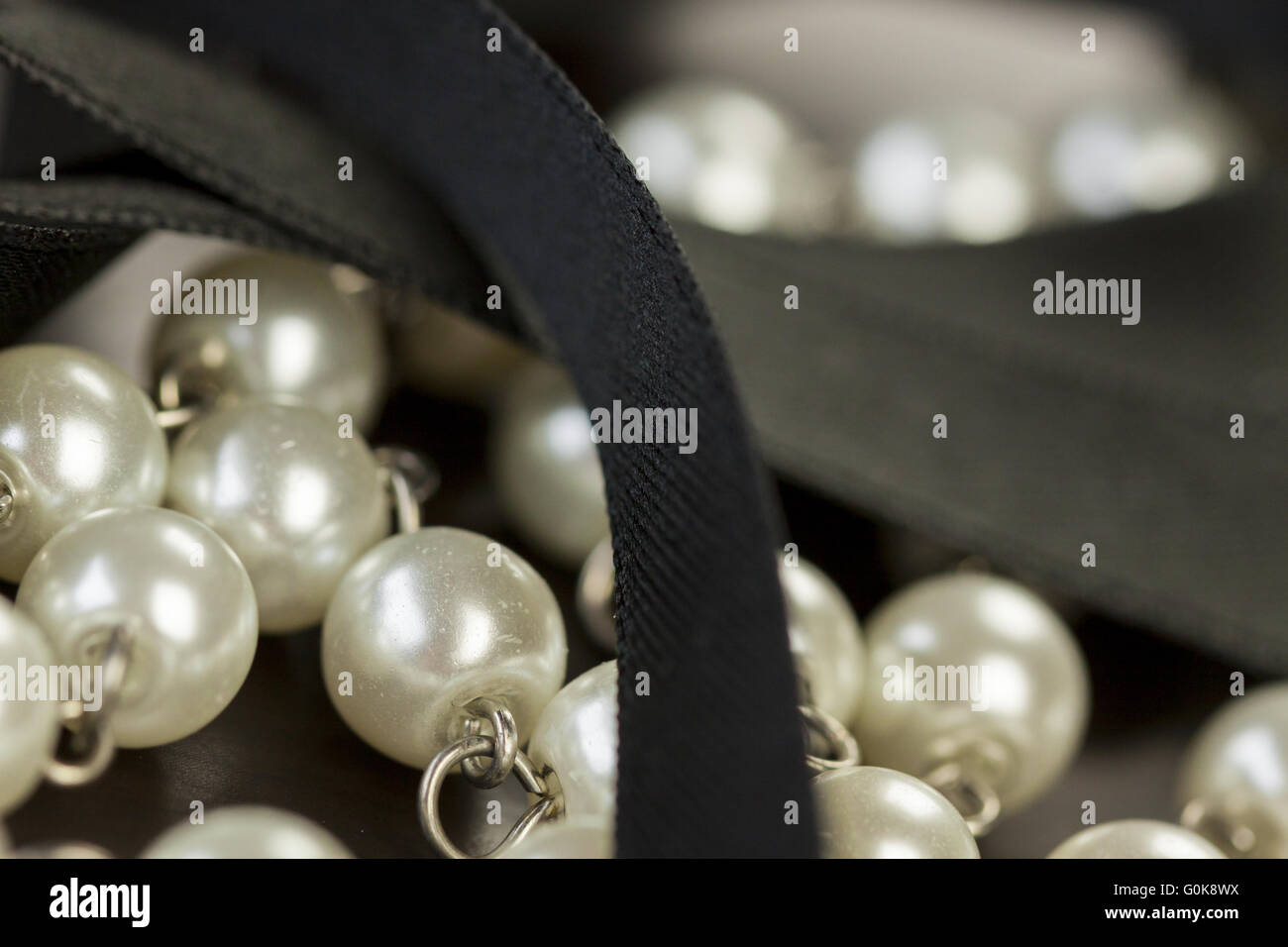 String of shiny grey beads Stock Photo - Alamy