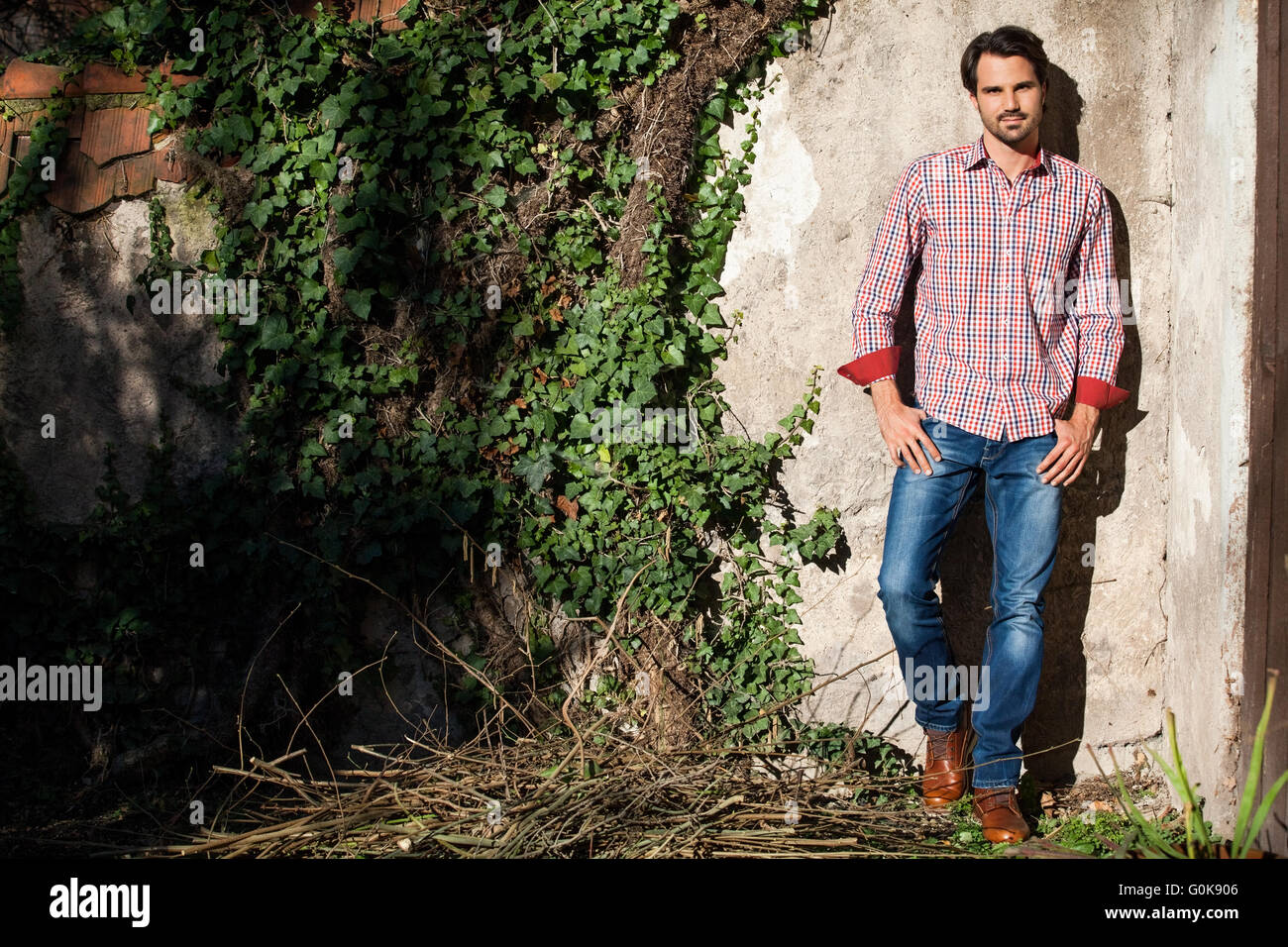 Male model sitting legs crossed hi-res stock photography and images - Alamy