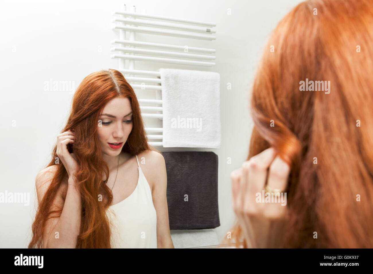 Mirror Reflection of a Long Hair Young Woman Stock Photo - Alamy