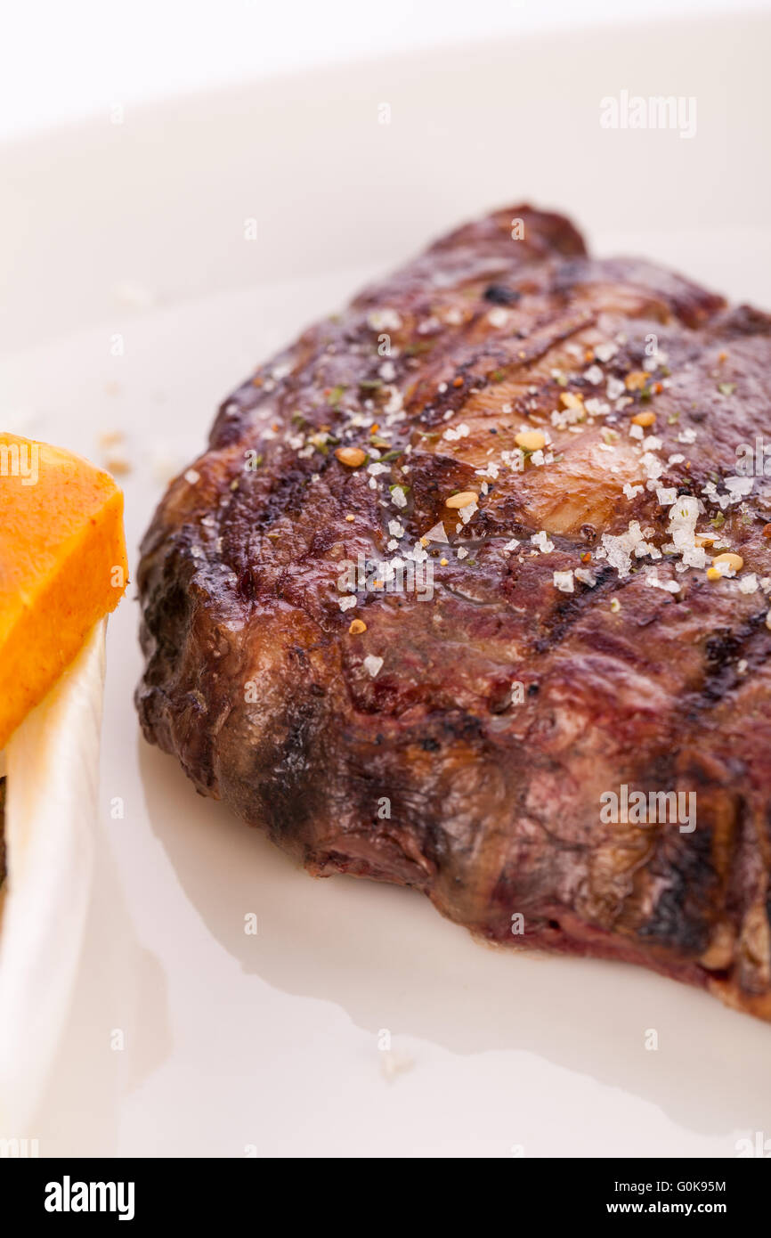 Grilled beef steak with seasoning Stock Photo - Alamy
