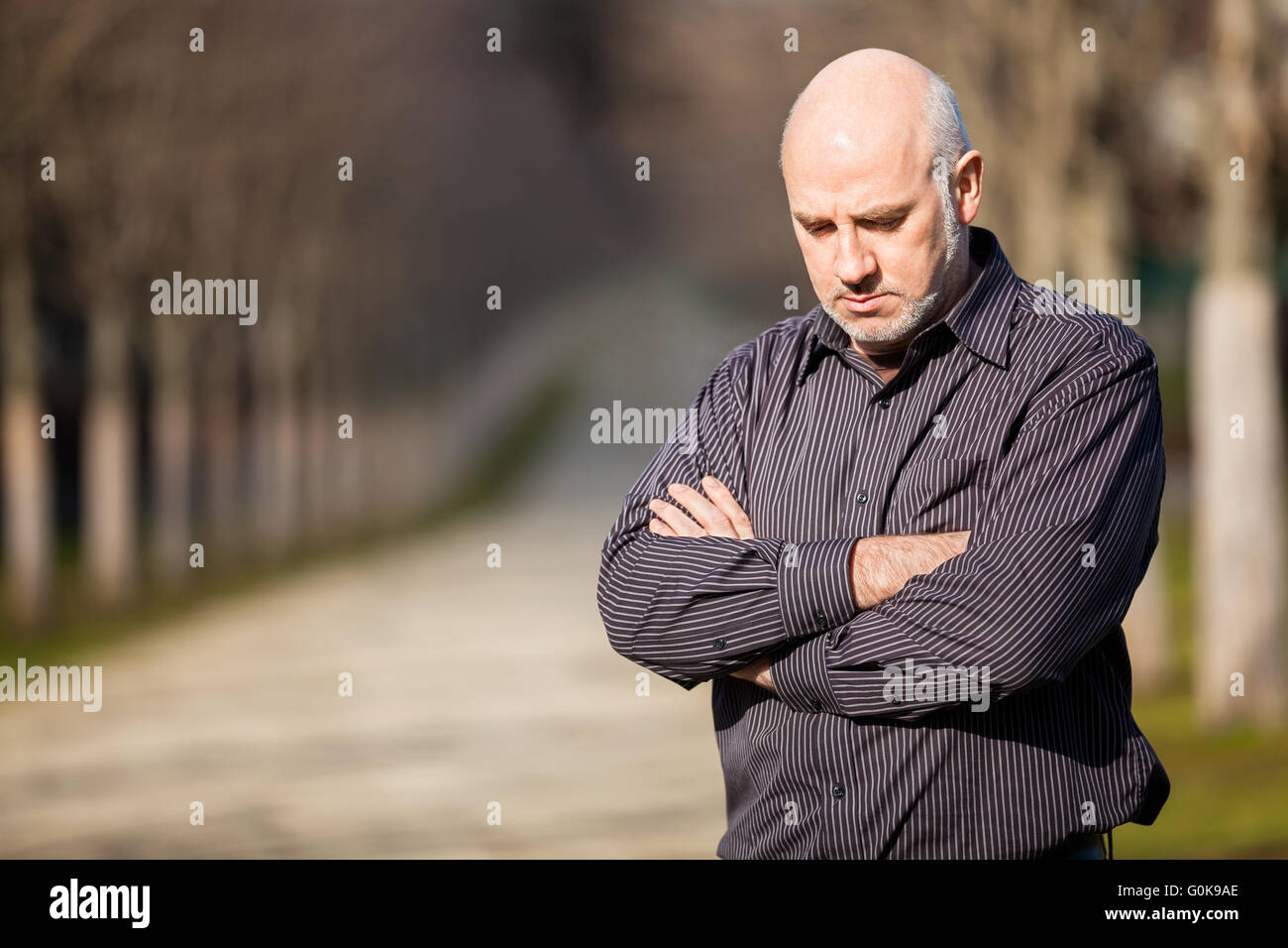Confident attractive man standing waiting Stock Photo - Alamy