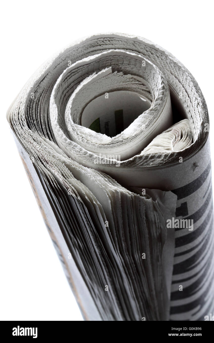 Rolled up newspaper isolated on white background Stock Photo - Alamy