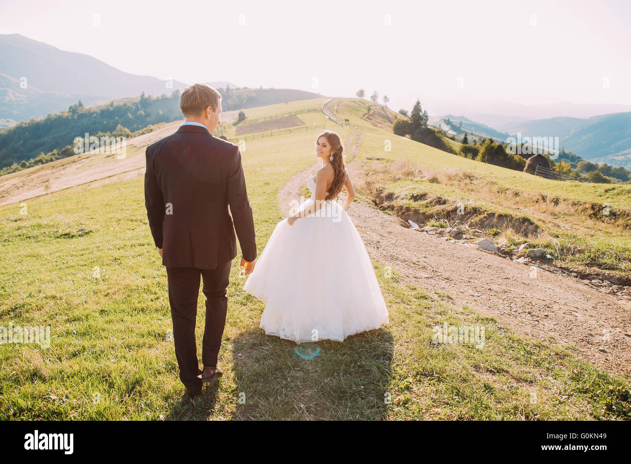 Back view young bride sunset hi-res stock photography and images - Alamy