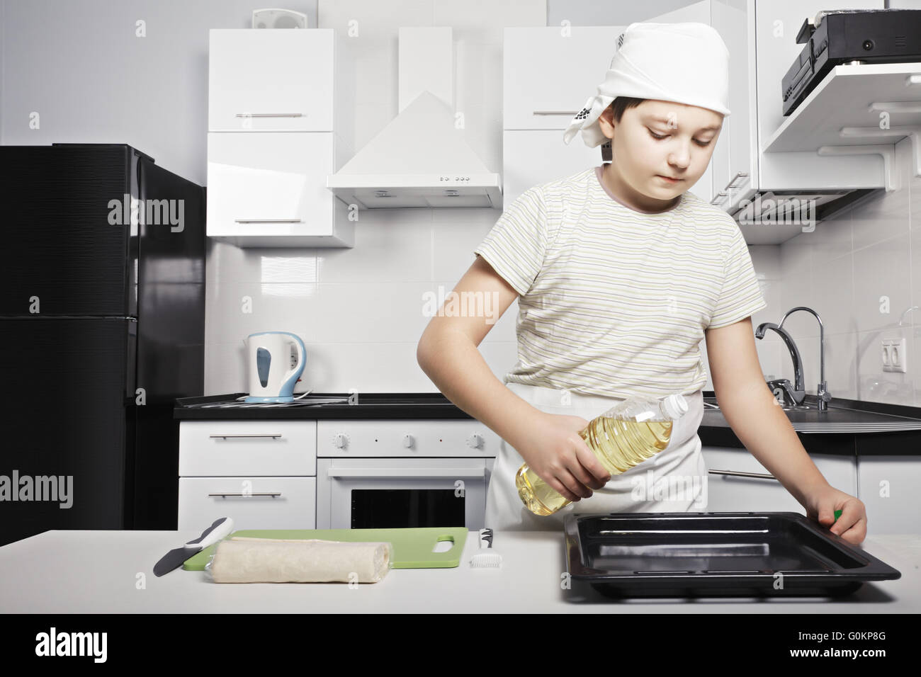 Pouring oil into pot Stock Photo - Alamy