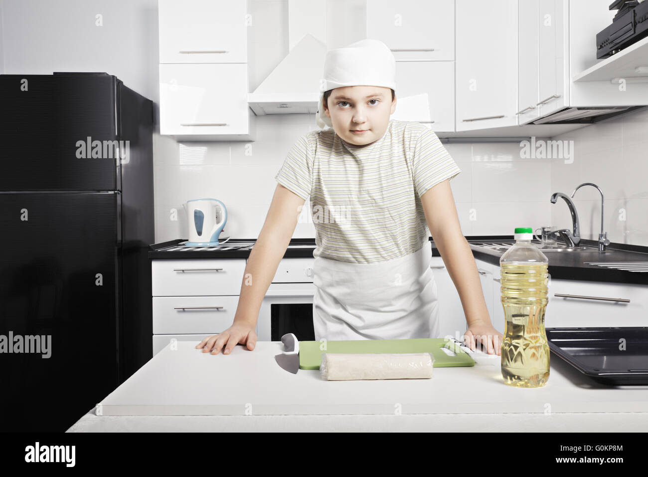 Boy prepared to cook Stock Photo - Alamy