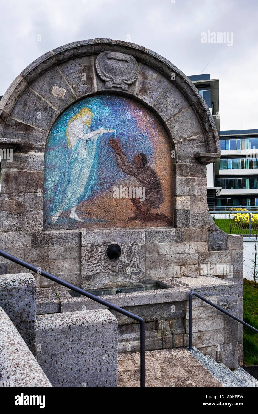 Old Mosiac water fountain with religious motif outside modern hospital ...