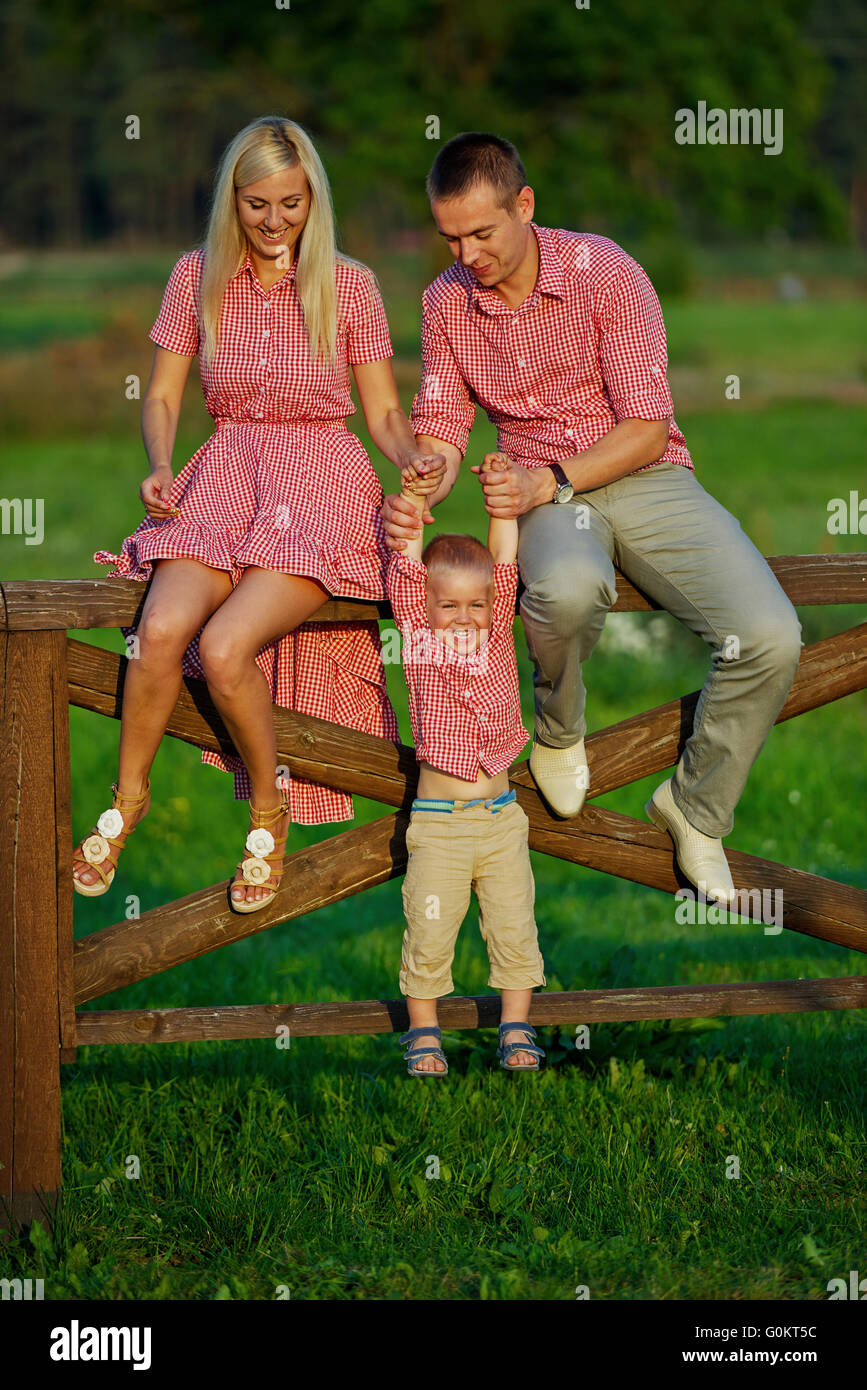 cute little boy with his parents outdoors Stock Photo - Alamy
