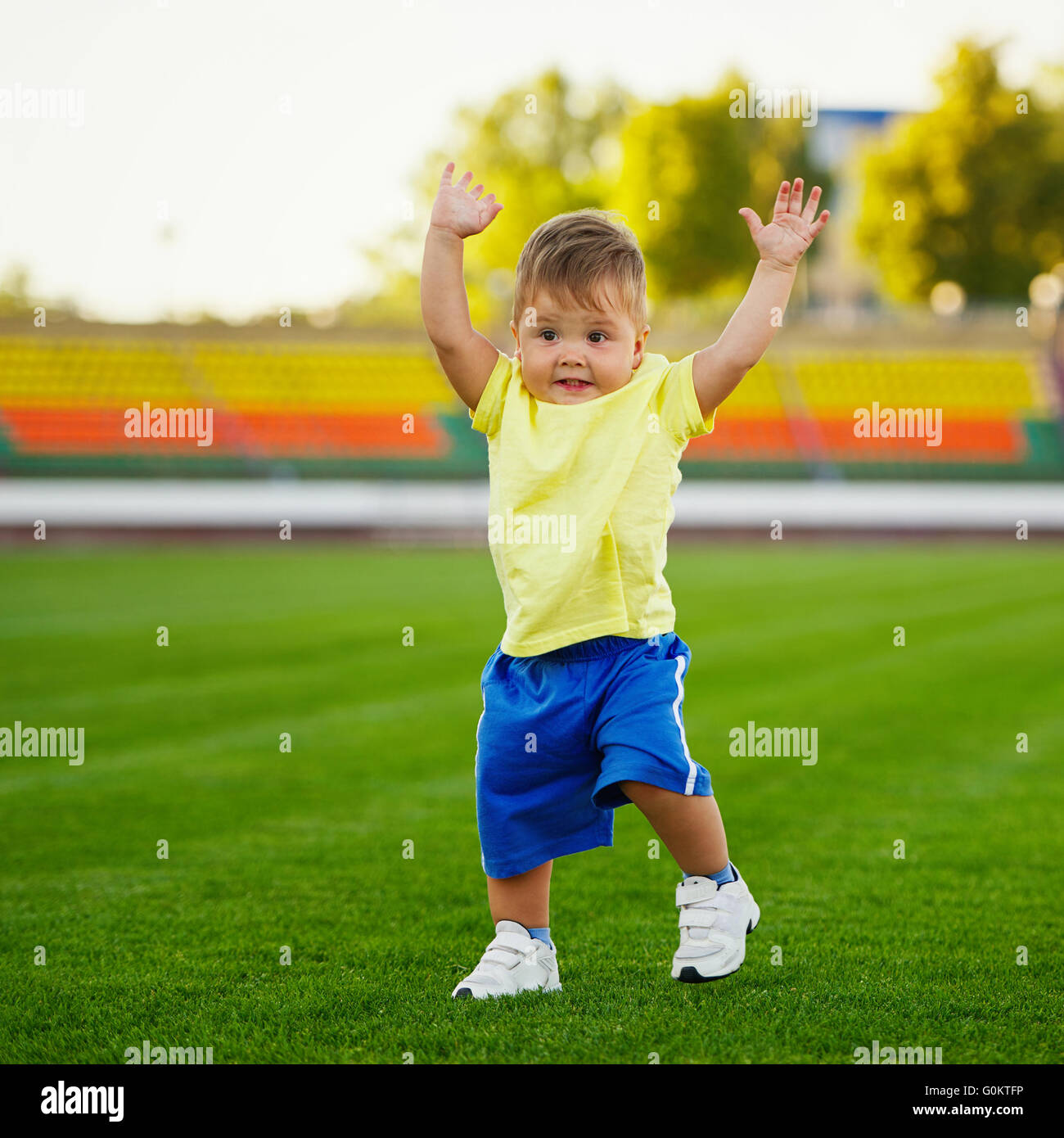 little funny boy on football field Stock Photo - Alamy
