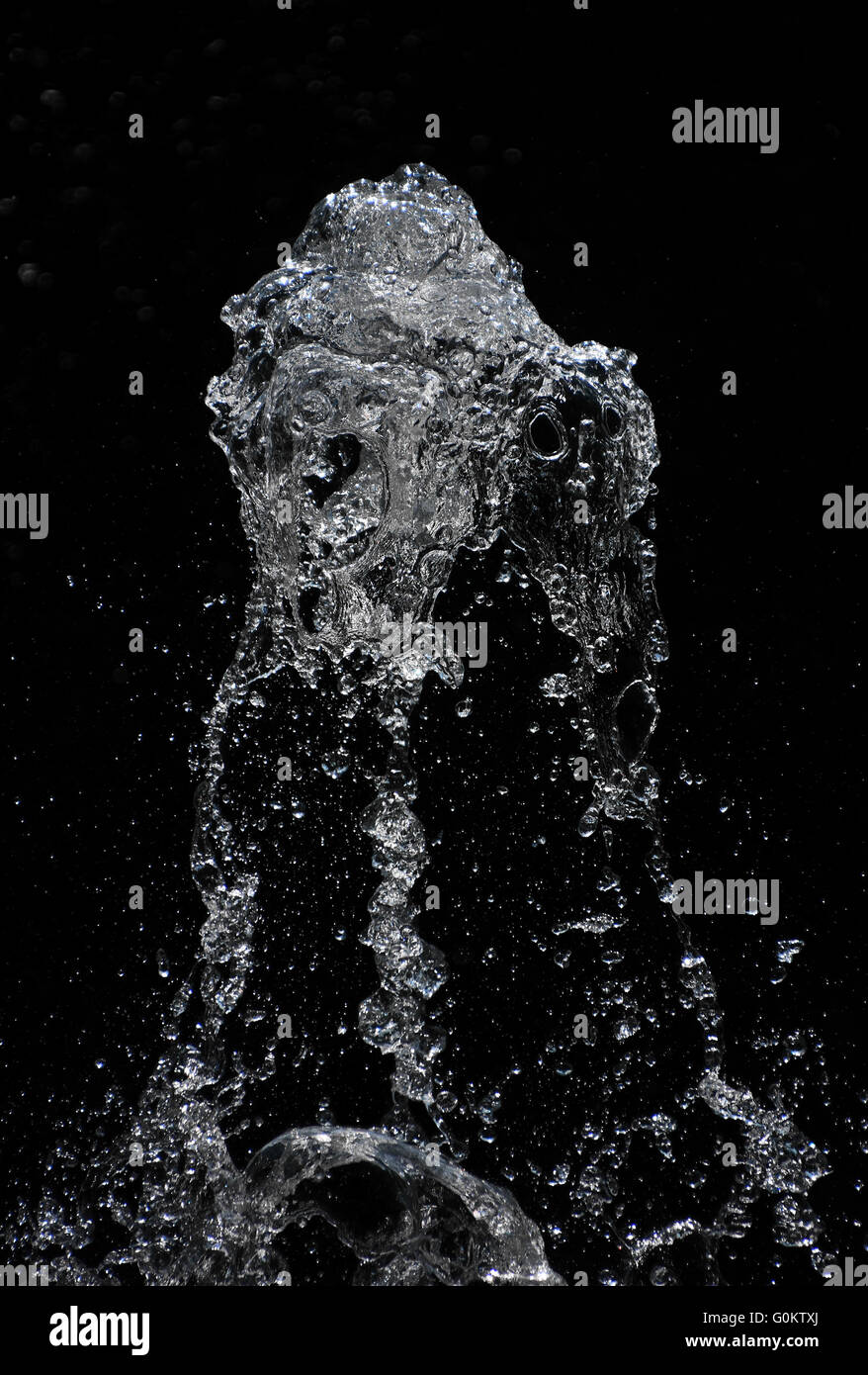 Fountain transparent water stream, splash and drops in motion over ...