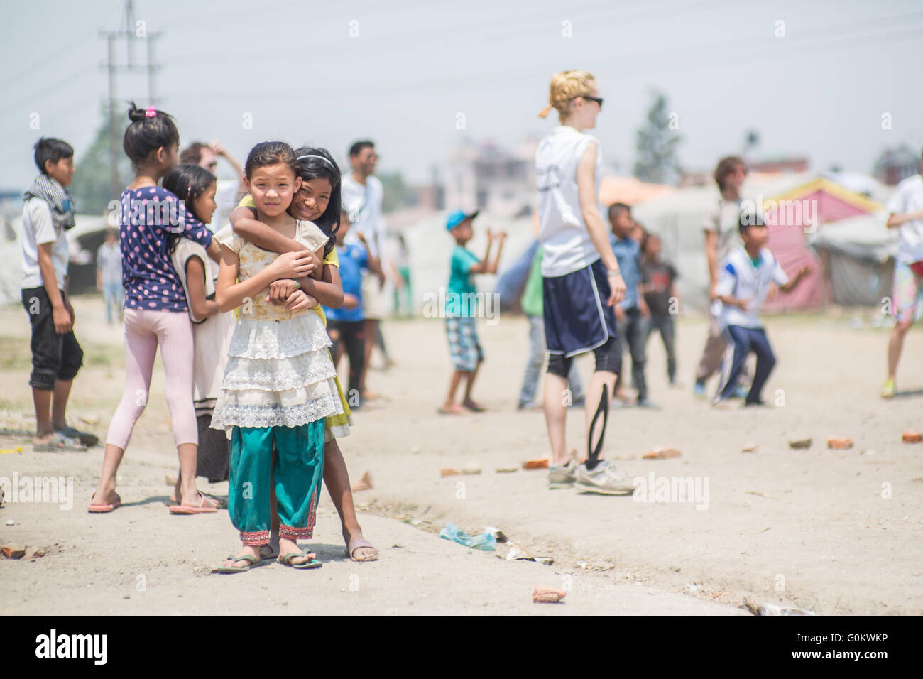 Kids from a camp during a "kids sports day" at a camp for families that ...
